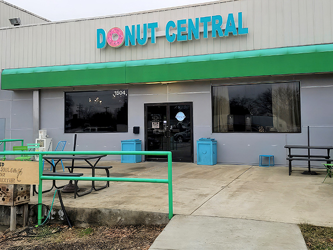 The mint-green outdoor seating area offers a perfect spot for donut contemplation. Philosophers should debate life's mysteries here, fueled by sugar.