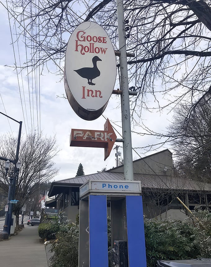 The iconic Goose Hollow Inn sign stands as a beacon for sandwich pilgrims, promising refuge from a world of mediocre meals.