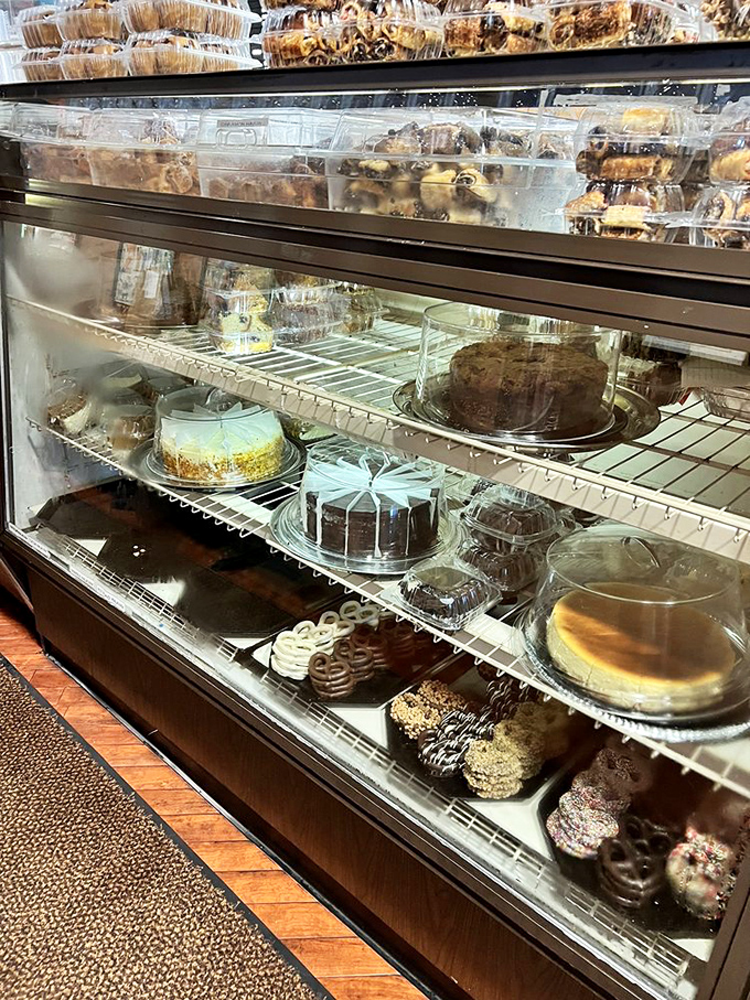 The dessert case: where willpower goes to die. Each shelf offers a different path to sweet satisfaction.