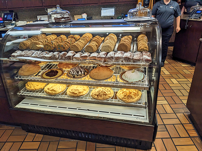 A dessert case that instantly transforms grown adults into wide-eyed children. Those pies aren't just baked, they're engineered for maximum happiness.
