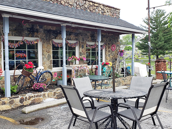 The charming patio, complete with vintage bicycle and colorful flowers, offers al fresco dining with a side of small-town West Virginia charm.