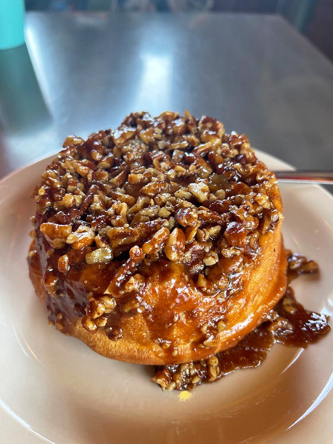 Not all heroes wear capes; some wear caramelized pecans atop a warm spiral of buttery dough that redefines morning happiness.