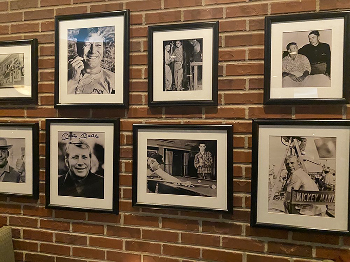 The wall of fame showcases the Commerce Comet himself, reminding diners they're eating in the house that Mickey built.
