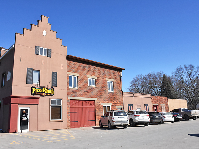 Even Pizza Ranch embraces the stepped-gable Dutch aesthetic, proving that pepperoni and Netherlands architecture make surprisingly good roommates.
