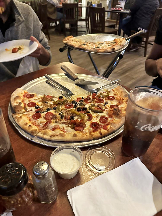 The perfect table scene&mdash;pizza, cold drinks, and friends. Some would call this heaven; I call it Tuesday night done right.