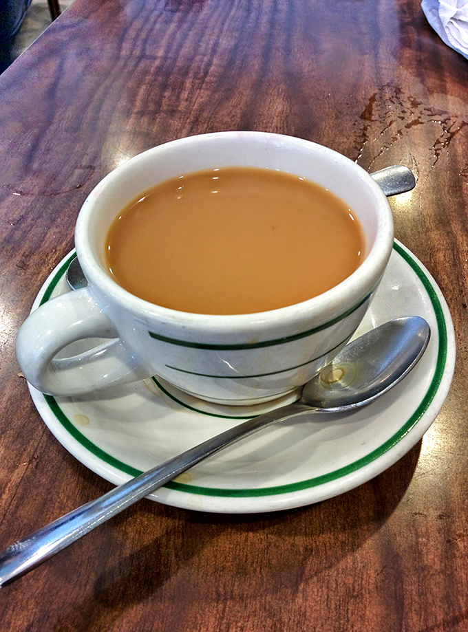 Coffee served in the classic green-striped mug &ndash; the unsung hero of breakfast, keeping Hot Springs locals and visitors equally caffeinated since forever.