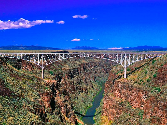 The Rio Grande Gorge Bridge suspends you between earth and sky. That tiny ribbon of water below carved this massive chasm over millions of years. 