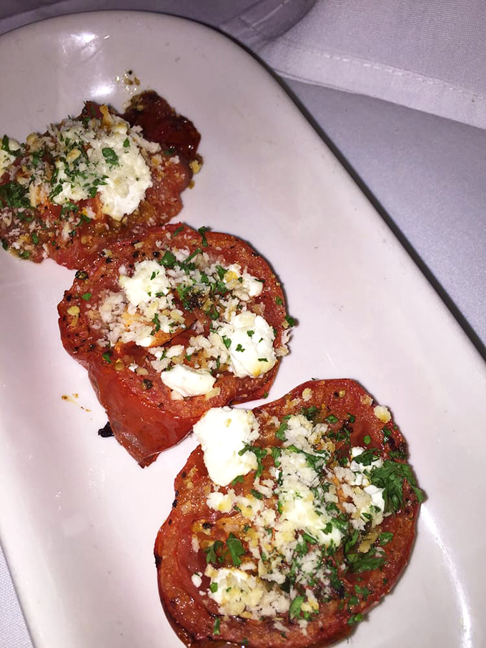 Roasted tomatoes wearing little hats of goat cheese &ndash; proof that sometimes the simplest preparations yield the most memorable bites.