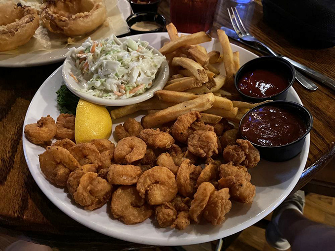 Shrimp swimming in savory broth alongside colorful vegetables &ndash; proof that seafood doesn't always need breading to shine brilliantly.