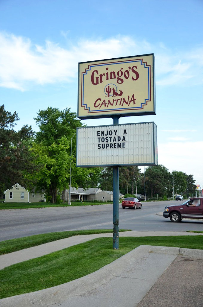 The roadside sign stands like a beacon of hope for hungry travelers, promising Southwestern salvation in the heart of Nebraska's cornfields.