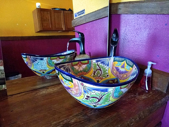 Even the bathroom sinks tell a story of colorful craftsmanship. These aren't fixtures&mdash;they're conversation pieces that make handwashing an event.