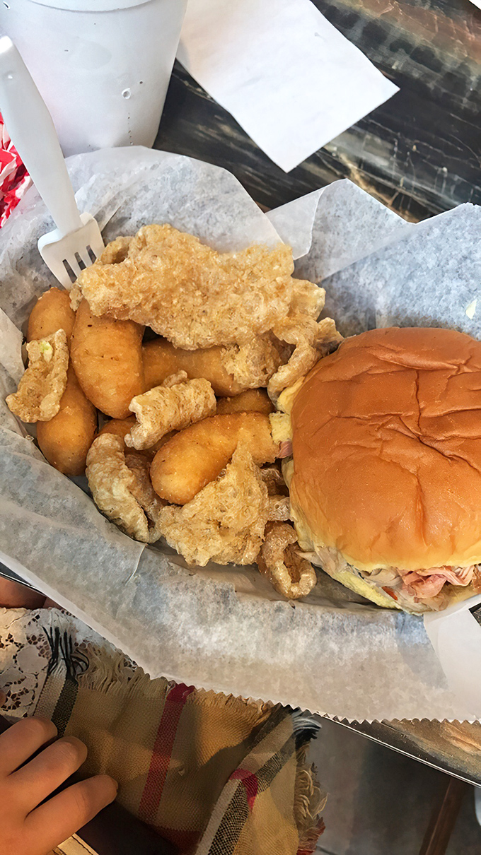 Some sandwiches need nothing more than meat and bread to achieve greatness—paired with hush puppies, it's practically a religious experience.