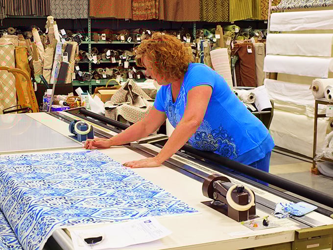 Craftsmanship in action &ndash; where expert hands transform raw materials into custom creations. The magic happens at the cutting table.