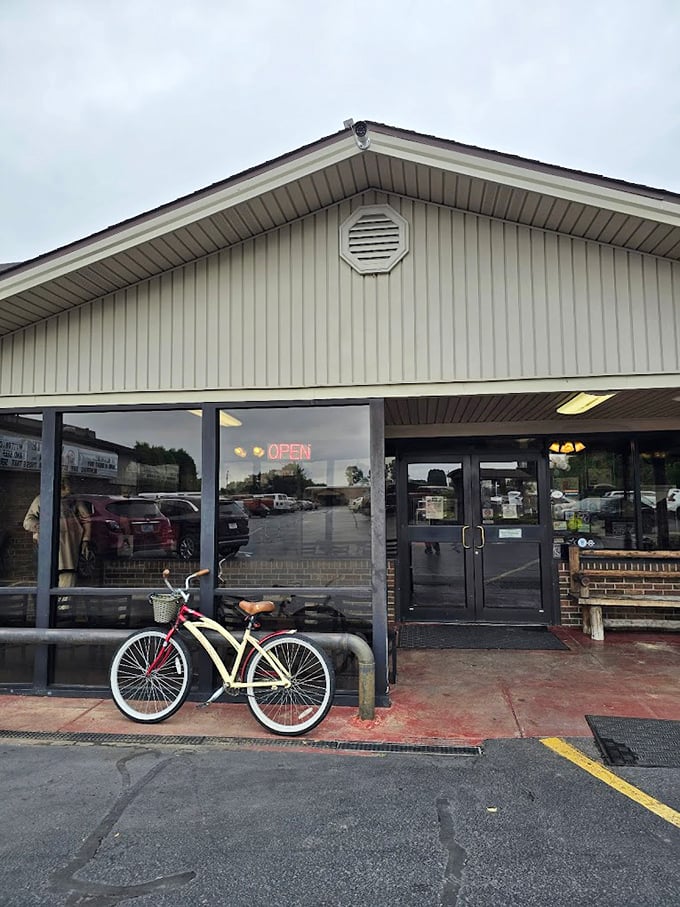 Even on rainy days, that "OPEN" sign glows like a beacon of hope. The bicycle suggests some locals are smart enough to live within walking distance.