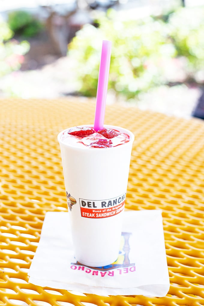 That pink straw signals joy ahead&mdash;a strawberry shake thick enough to require serious bicep strength and worthy of every calorie.