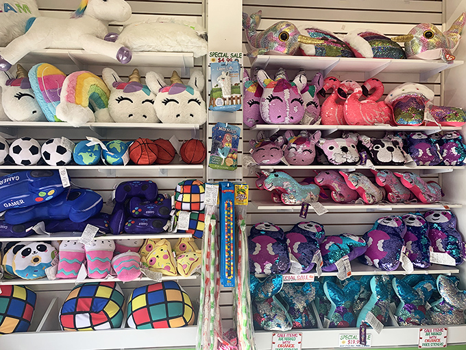 Stuffed animals stand guard over the candy kingdom, soft sentinels waiting to be adopted alongside their sweet companions.