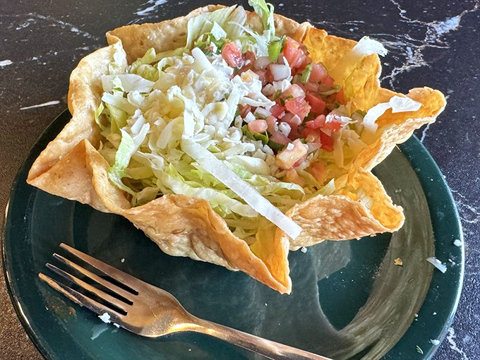 Their margarita comes in a glass that belongs in an art museum. Vibrant, festive, and making ordinary glassware seem utterly forgettable.