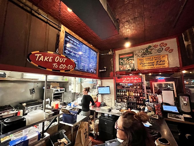 The takeout counter &ndash; where "I'll just grab something quick" turns into a full-on feast that perfumes your car with smoke-infused goodness.
