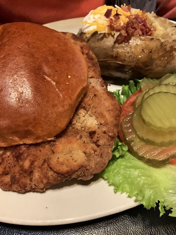 This isn't just a tenderloin sandwich&mdash;it's architecture, engineering, and art on a bun. Those pickles aren't garnish; they're necessary contrast.