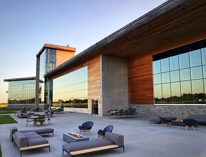 Sunset transforms this modern distillery patio into a bourbon lover's paradise&mdash;where fire pits flicker and spirits flow under Kentucky's painted sky.