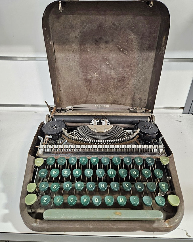 A vintage Skyriter typewriter with mint-green keys&mdash;the Instagram filter of writing tools long before social media made everything look nostalgic.