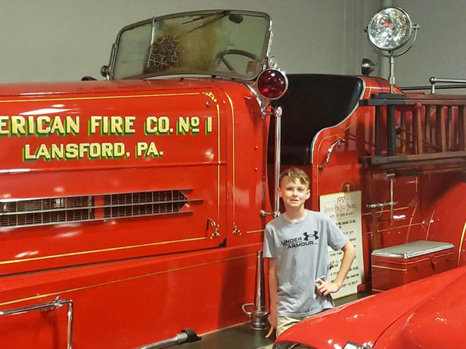 This vintage fire truck has seen more action than most Hollywood stuntmen. The young visitor seems to be plotting his future career choices.