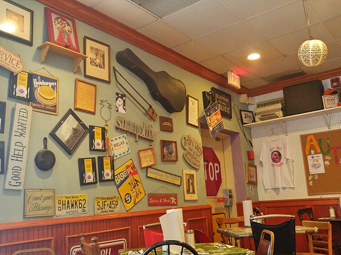 The walls aren't decorated – they're curated with decades of personality. That guitar probably has heard more breakfast orders than songs.