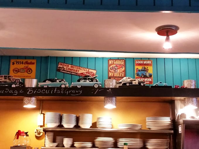 Vintage signs and model cars line the shelves, creating a museum of Americana that happens to serve incredible comfort food.
