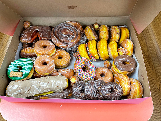 A pink box of possibilities. Like a treasure chest for grown-ups, each donut promising its own unique adventure.