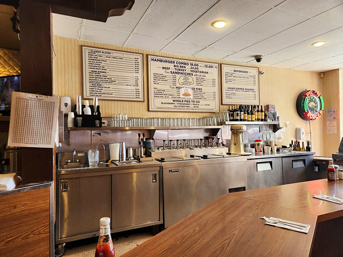 Behind the counter, where the magic happens. Gleaming equipment stands ready for the next round of burger alchemy and milkshake wizardry.