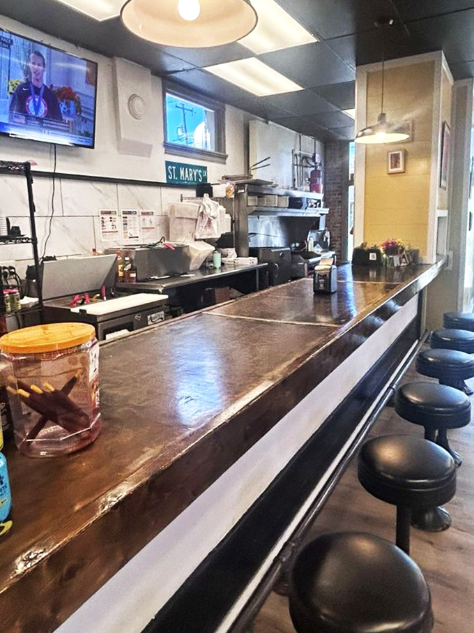 The counter where culinary dreams come true, one order at a time. Notice the St. Mary's sign&mdash;a touch of neighborhood character.