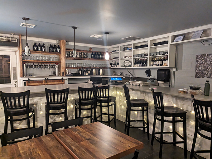 A bar that understands the sacred relationship between fresh oysters and cold drinks. The white cabinets hold glasses that are about to make someone's day better.