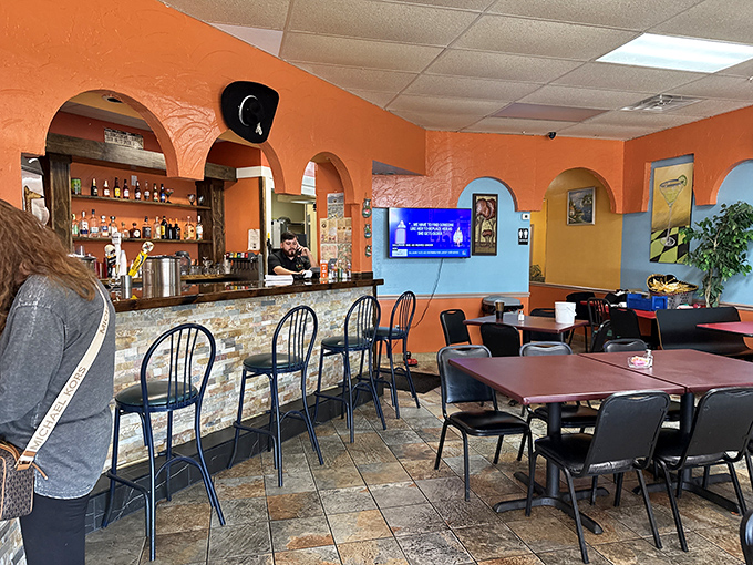 The bar area doesn't just serve drinks&mdash;it serves possibilities. Those arched doorways frame the experience like portals to a more flavorful dimension.