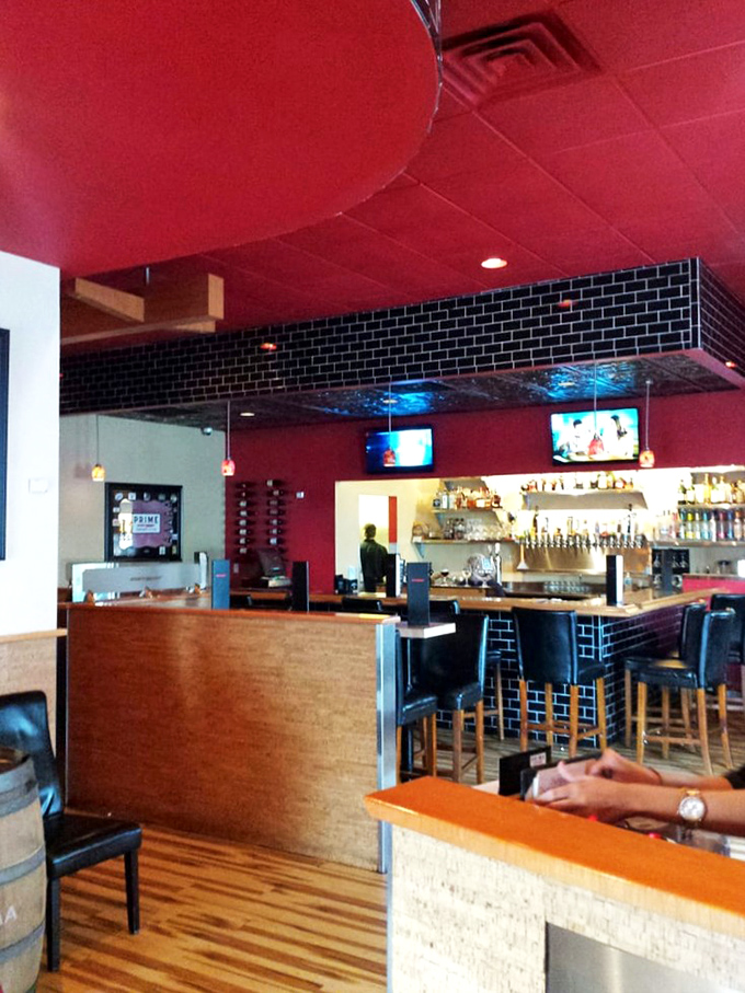 The bar where cocktail craftspeople perform their liquid alchemy. Notice the black subway tile that says, "Yes, we take our drinks as seriously as our steaks."