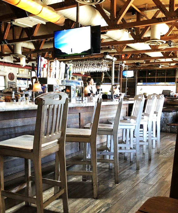 The bar area &ndash; where seafood stories get taller with each round. A perfect perch for solo diners or those waiting for their coastal feast.