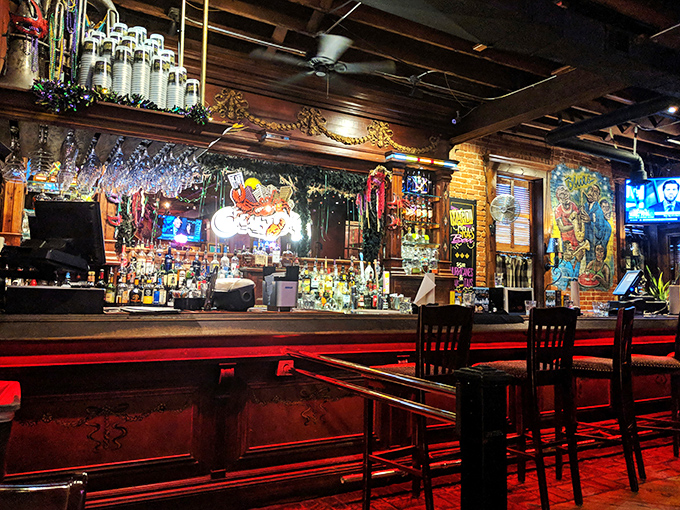The bar glows with an inviting warmth that says, "Your bourbon and beer are serious business here, even if we're not."