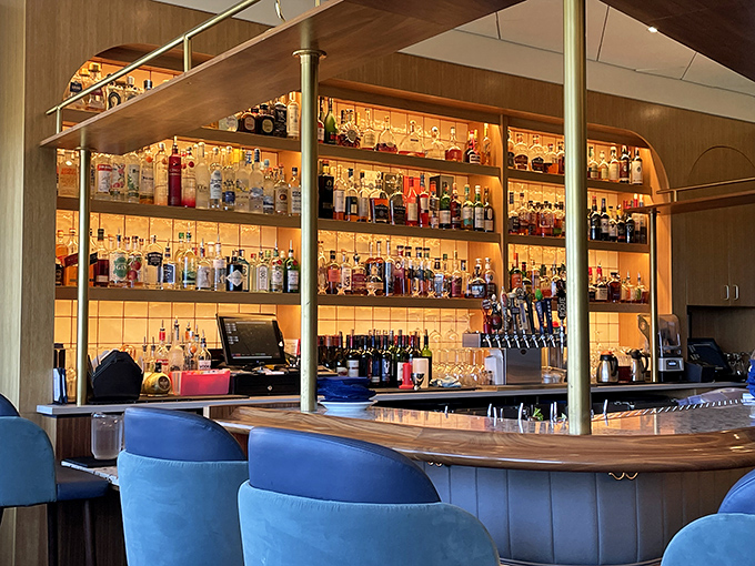 This isn't just a bar&mdash;it's a library of liquid joy, where bottles glow like sacred texts promising revelations with each sip.