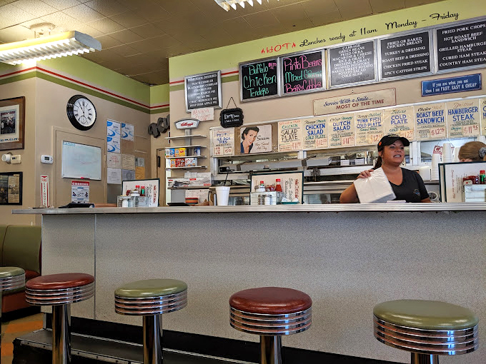 The counter where regulars perch on chrome stools, watching their breakfast materialize while trading stories with longtime servers.