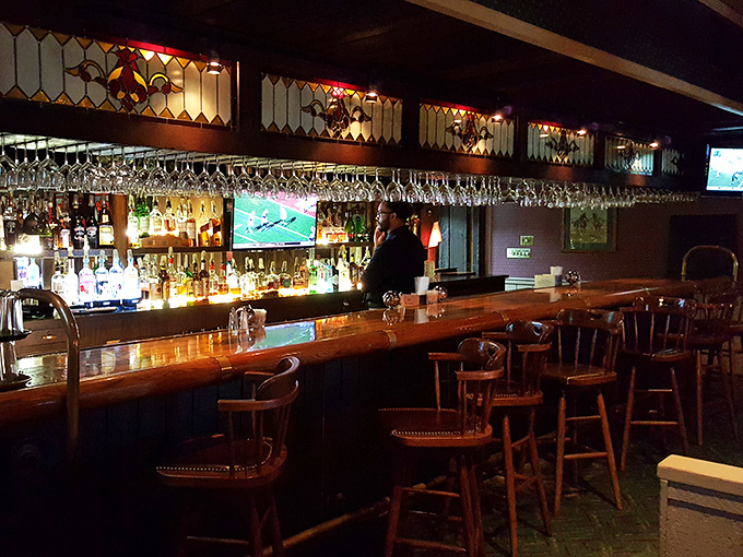 The bar at Mountain Jacks&mdash;where strangers become friends and friends become family. Those stained glass accents add a touch of class.