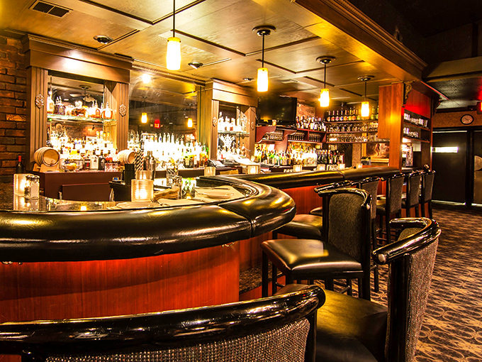 A bar that understands drinking is a social art - curved for conversation and stocked with everything needed to toast life's victories.