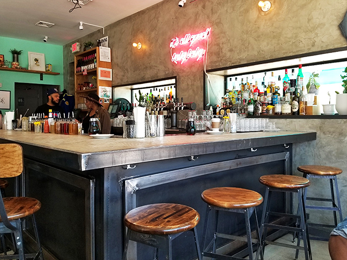 The bar at Sweet Chick isn't just serving drinks; it's serving experiences with bartenders who treat cocktail-making like an art form.