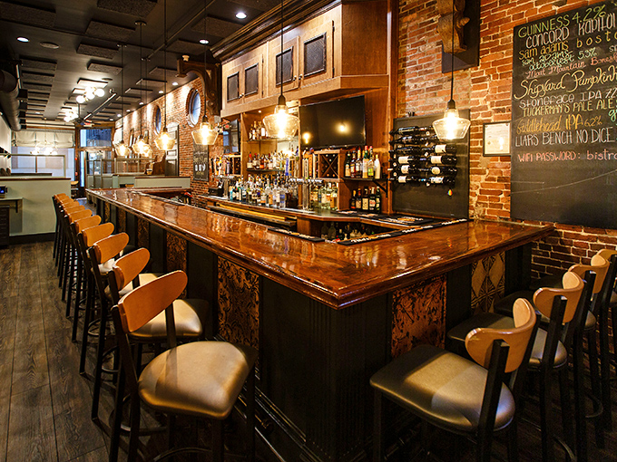 The bar isn't just a place to wait for your table; it's a destination unto itself, with woodwork that would make Ron Swanson nod in silent approval.