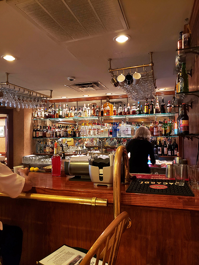 A well-stocked bar that says, "Yes, we take our cocktails as seriously as our fried chicken." The gleaming bottles promise liquid Southern charm.