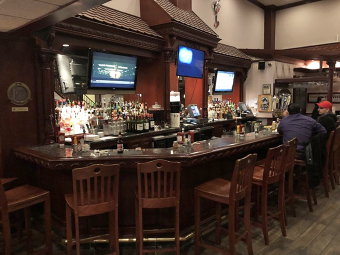A proper bar where stories flow as freely as the drinks. Notice nobody's looking at their phones &ndash; the food commands full attention.