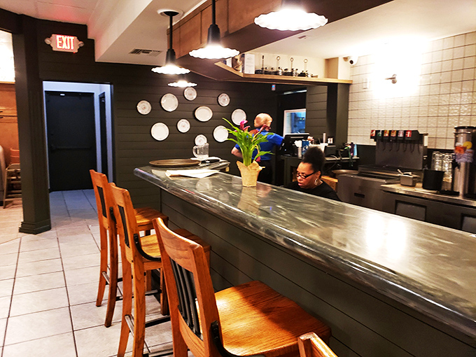 The bar area feels like the cool cousin of your grandmother's kitchen&mdash;familiar comfort with just enough style to keep things interesting.