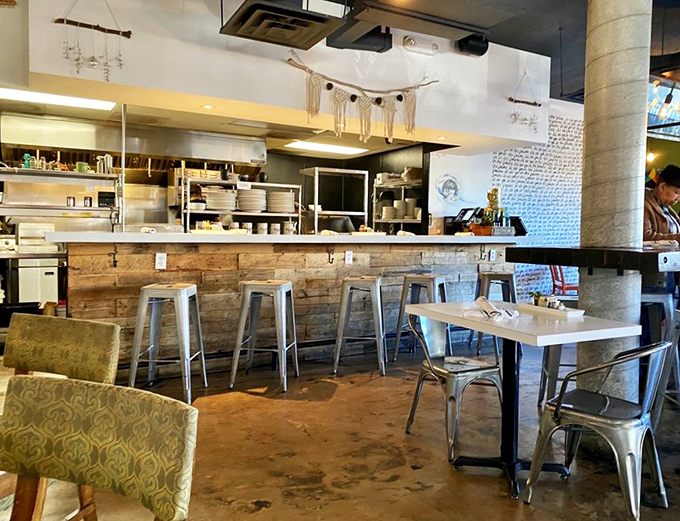 The open kitchen concept &ndash; where culinary transparency meets rustic wood and metal. Watch your breakfast come to life before it changes yours.