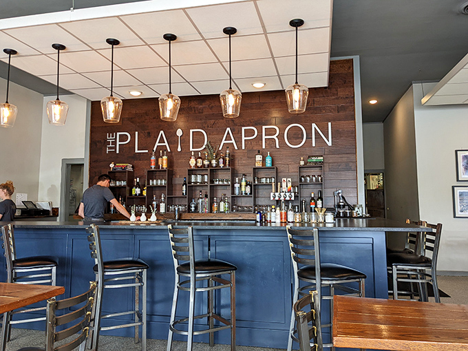 The bar isn't just serving drinks&mdash;it's crafting liquid companions for your meal. Those pendant lights could make anyone look like they're in a food documentary.