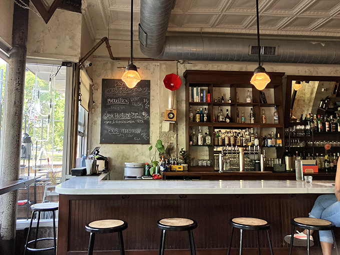 A bar that transitions seamlessly from morning mimosas to evening cocktails. That chalkboard menu hints at seasonal specials worth investigating.