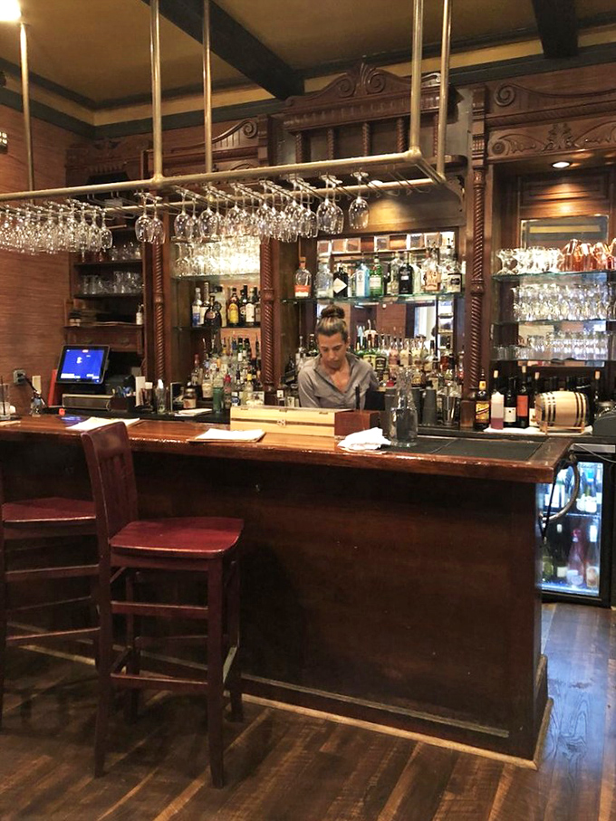 A bar that looks like it belongs in a period film, where bartenders craft cocktails with the precision of watchmakers.