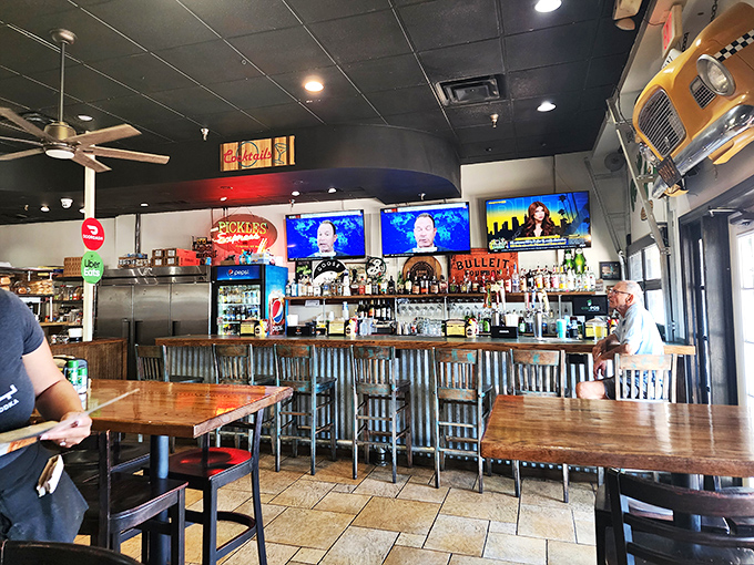 The bar area offers a perfect perch for solo diners or those waiting for takeout. Every seat provides a view of deli magic in action.